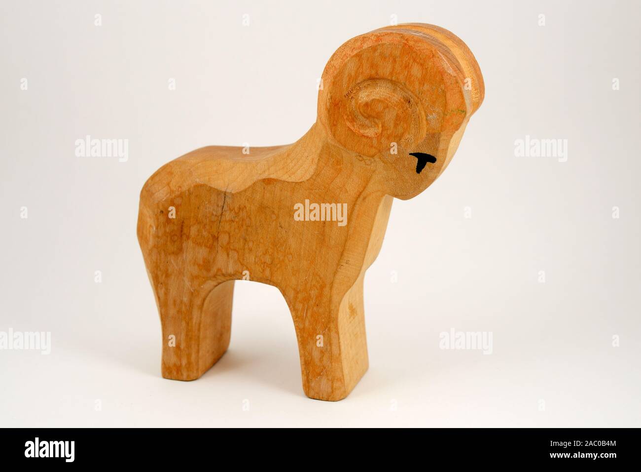 traditional wooden toy ram on a white background Stock Photo - Alamy