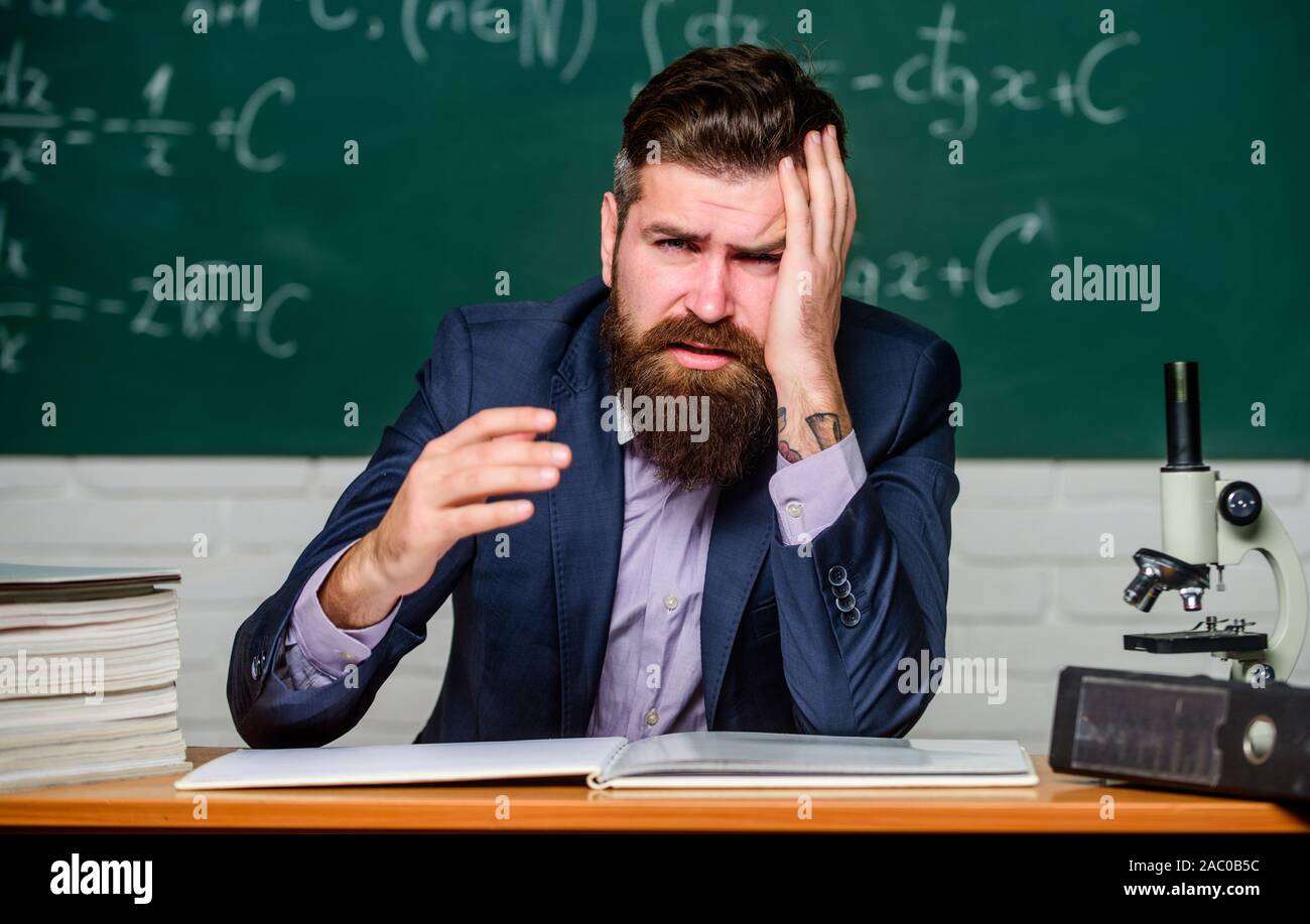 Stressed and fatigued. Teacher have headache of stress. Too much stress ...