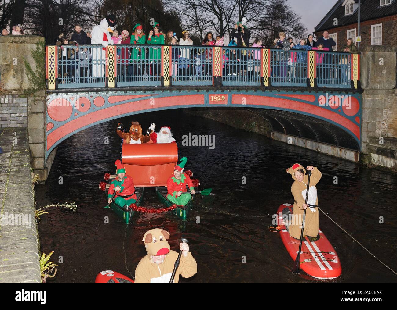 Father Christmas arrives by sleigh boat under the towns Iron Bridge ...