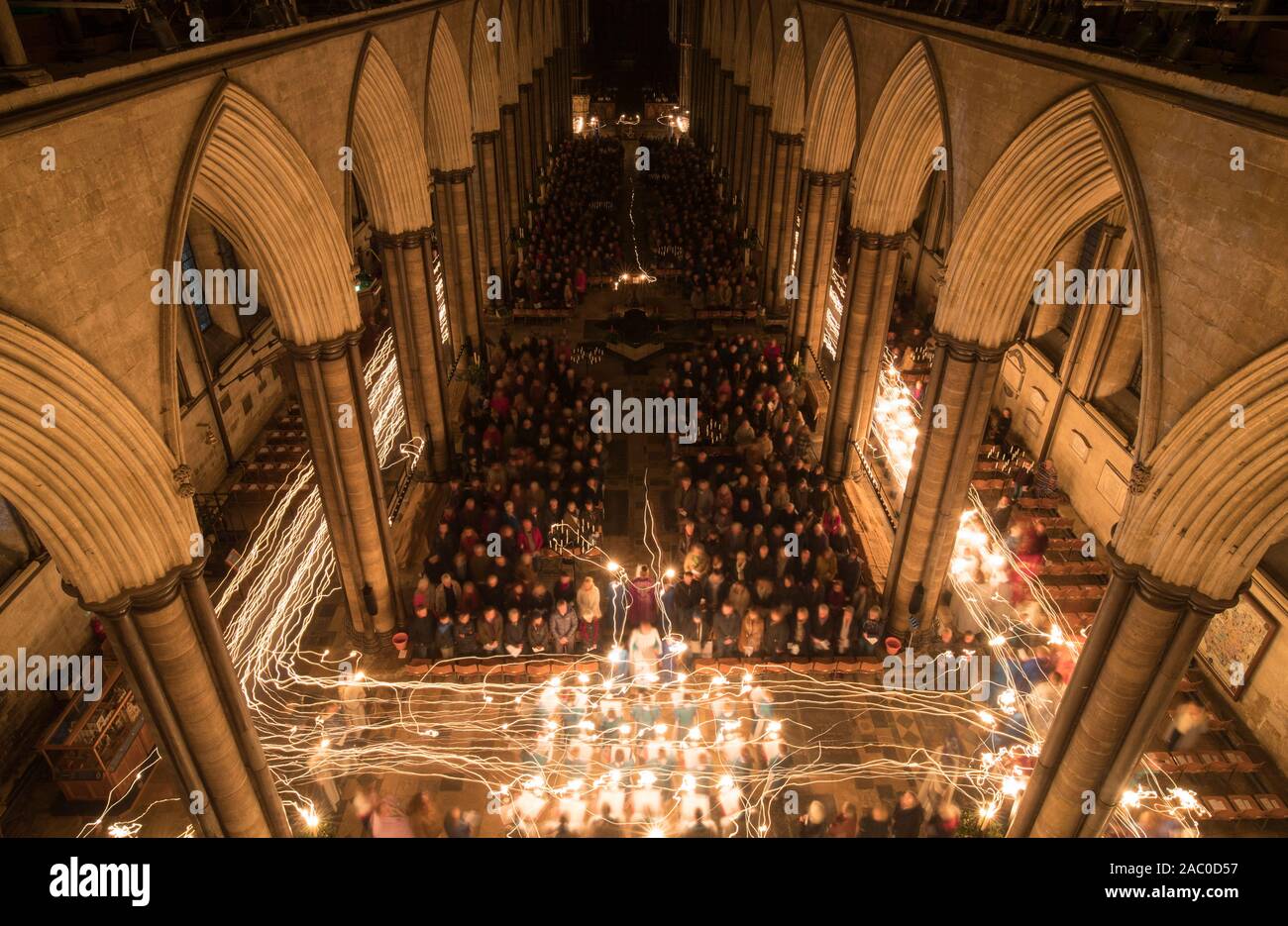 Candles are carried through Salisbury Cathedral during the advent ...