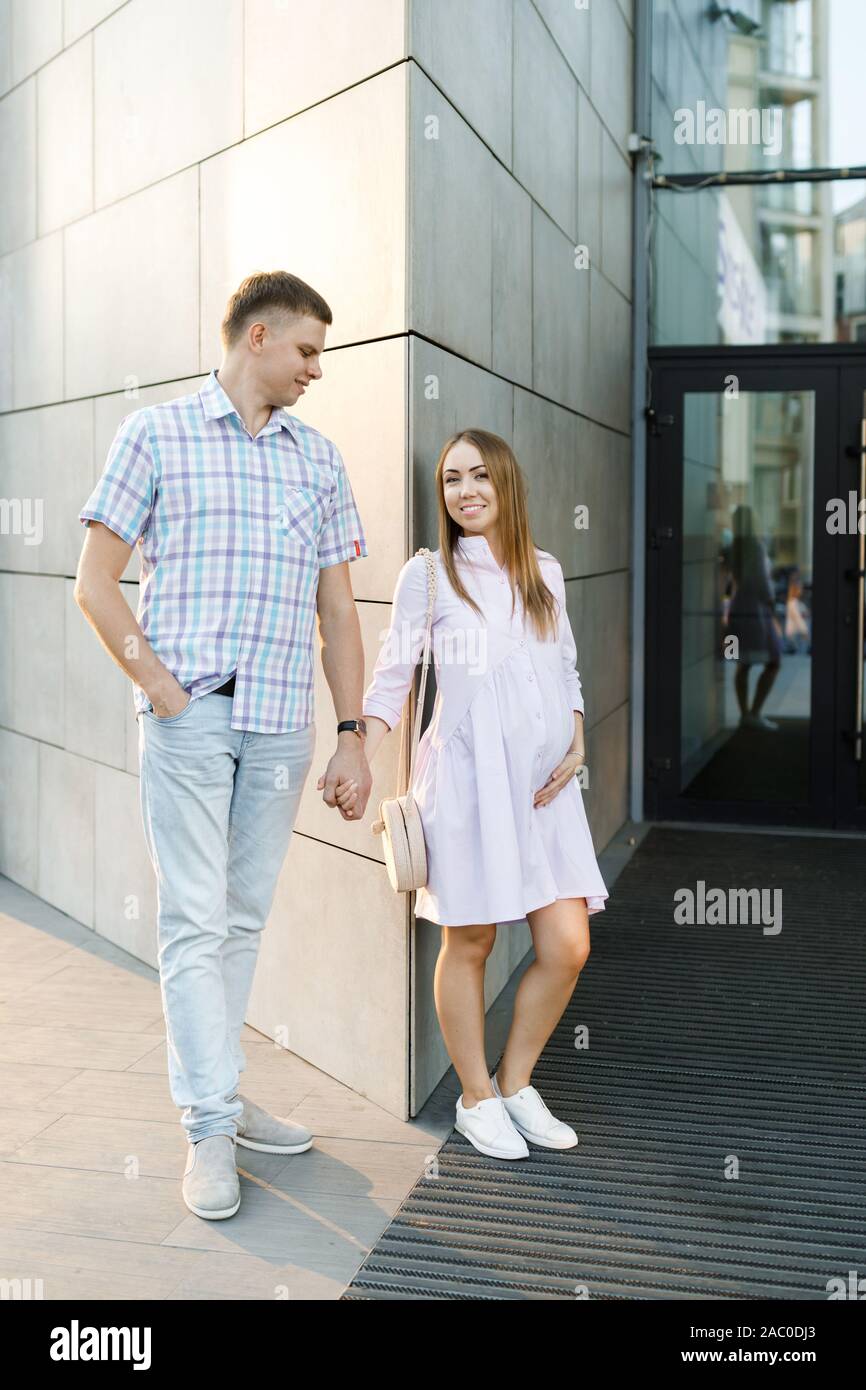 Young couple - man and woman expecting baby, spend time together on ...