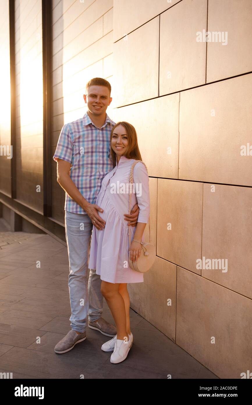 Young couple - man and woman expecting baby, spend time together on ...