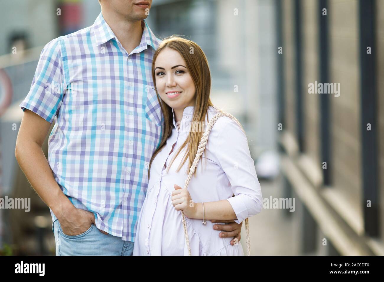 Young couple - man and woman expecting baby, spend time together on ...