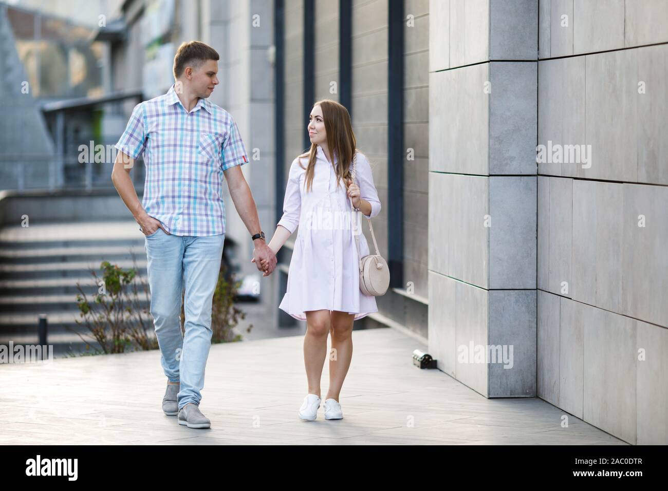 Young couple - man and woman expecting baby, spend time together on ...
