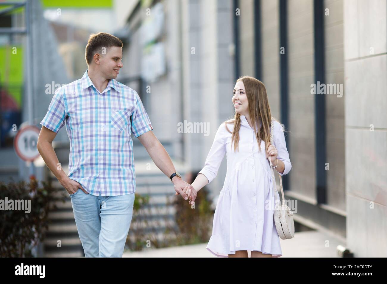Young couple - man and woman expecting baby, spend time together on ...