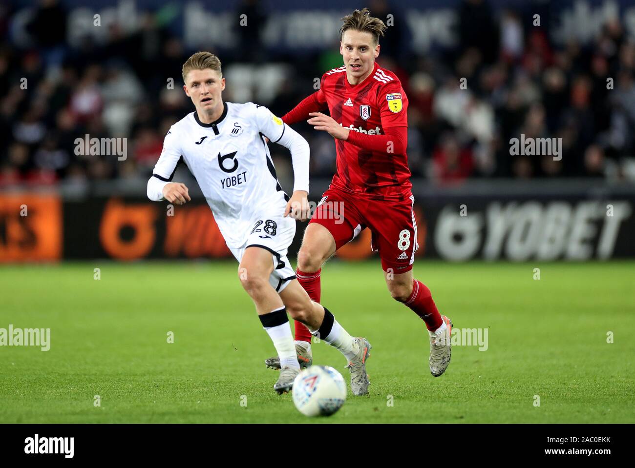 Swansea City's George Byers (left) and Fulham's Stefan Johansen during ...