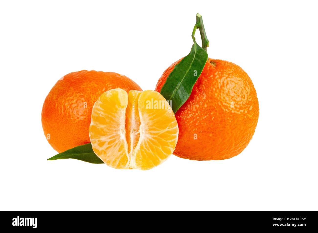 mandarin fruits whole and halved isolated on white Stock Photo - Alamy