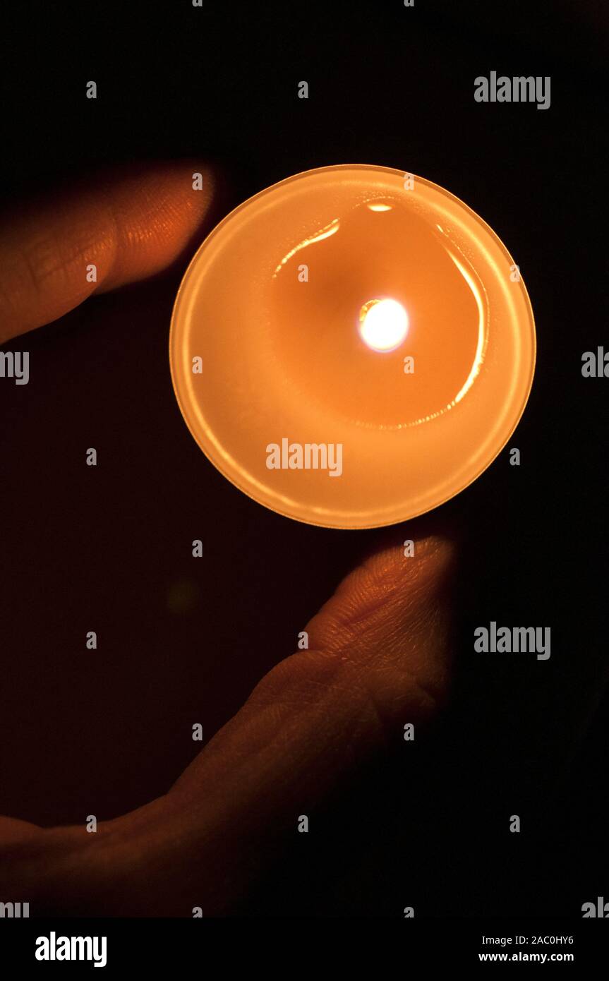 Hand holding candle hygge hi-res stock photography and images - Alamy