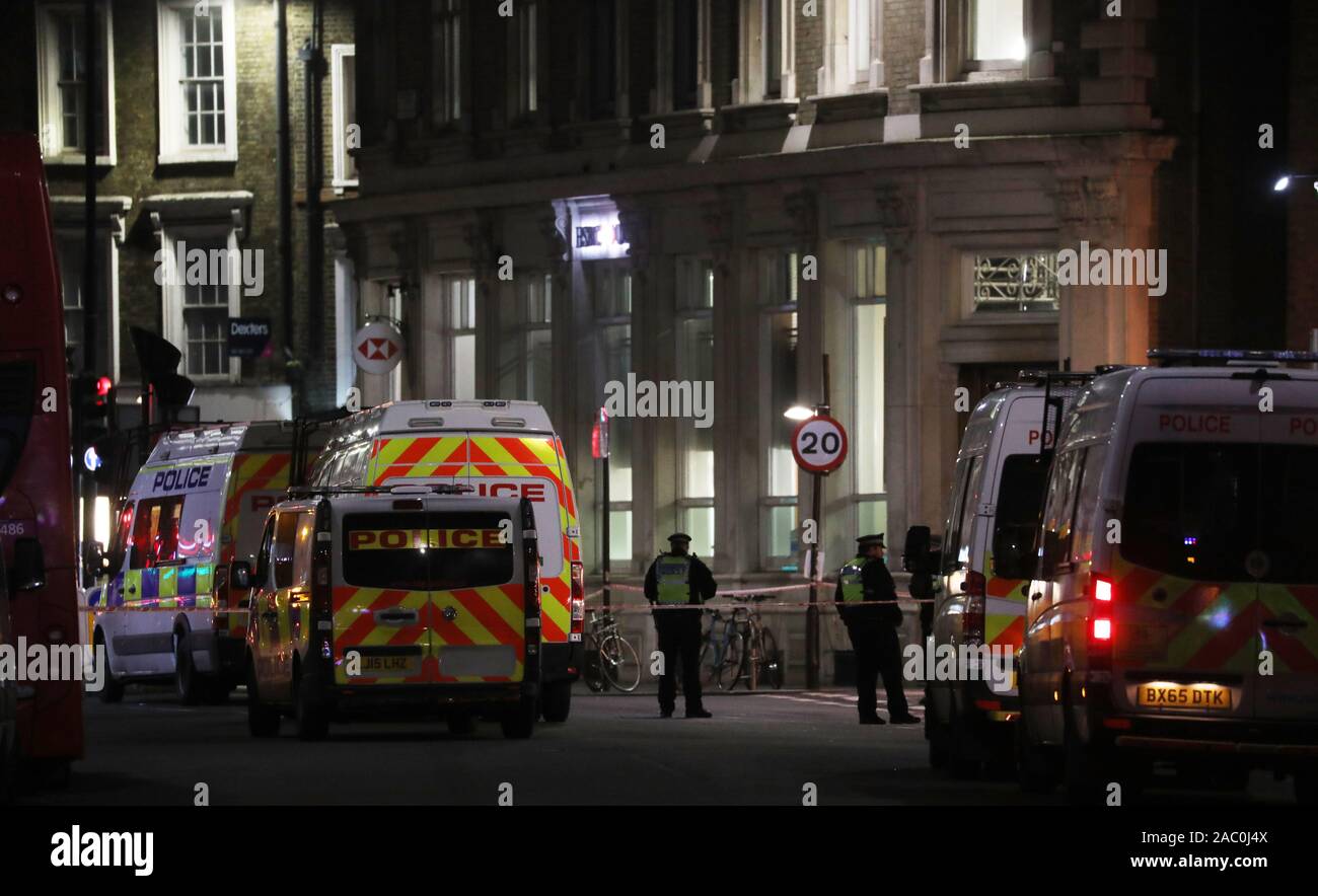 London, Britain. 29th Nov, 2019. Police officers cordon off the scene ...