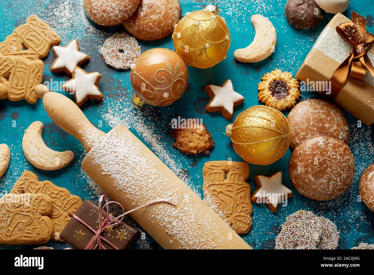 Christmas seasonal baking background with a rolling pin, gifts and ...