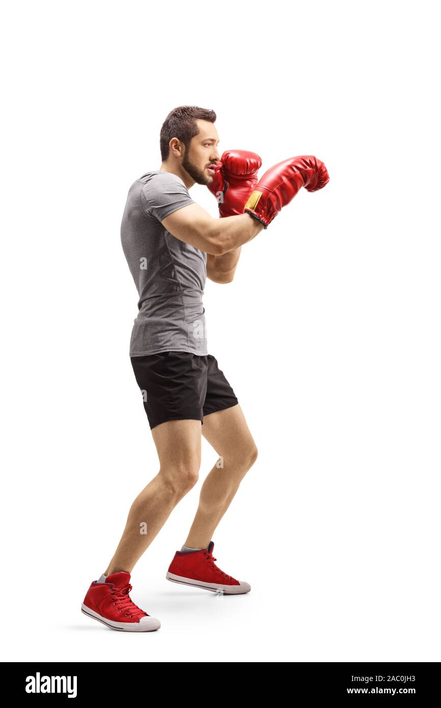 Full length shot of a man training box isolated on white background ...