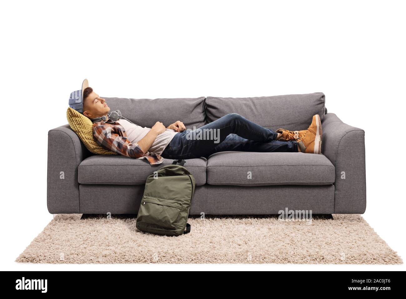 Male student sleeping on a sofa isolated on white background Stock ...