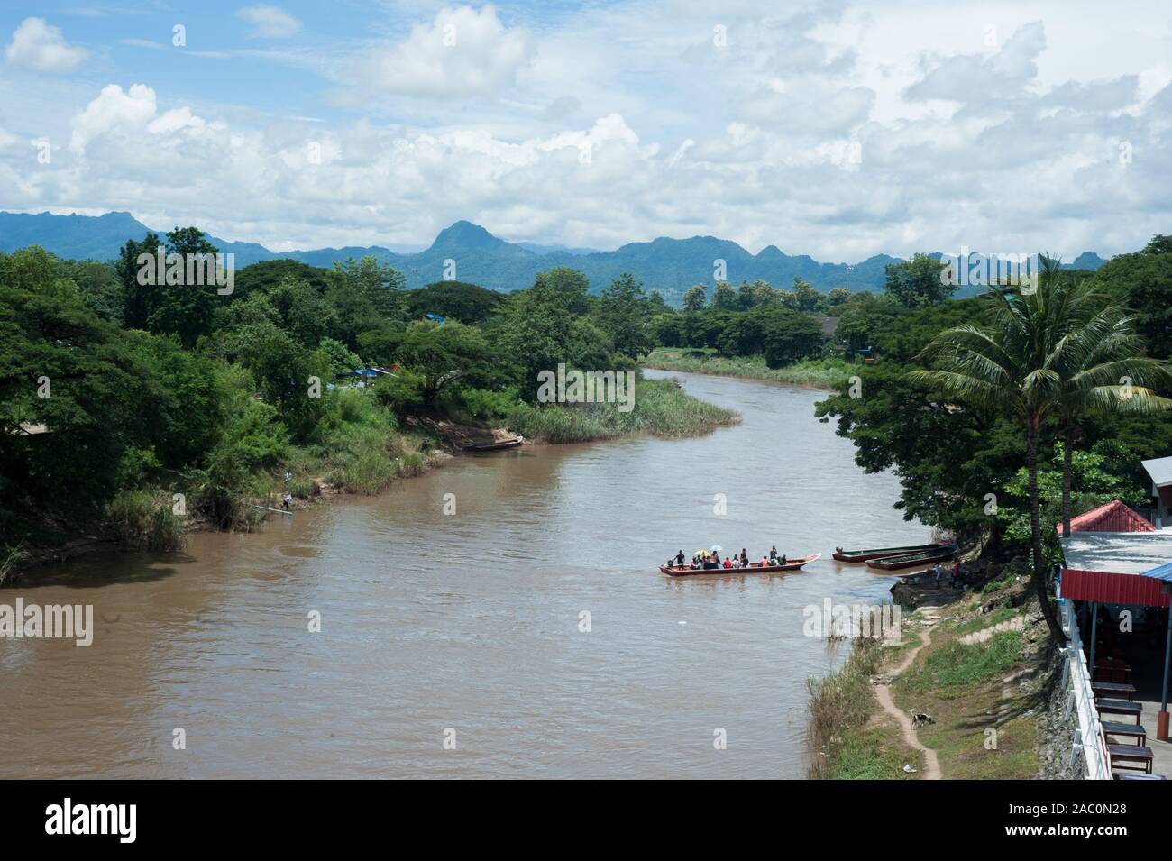 A boat on the Moei River, a natural border between Mae Sot, Thailand ...