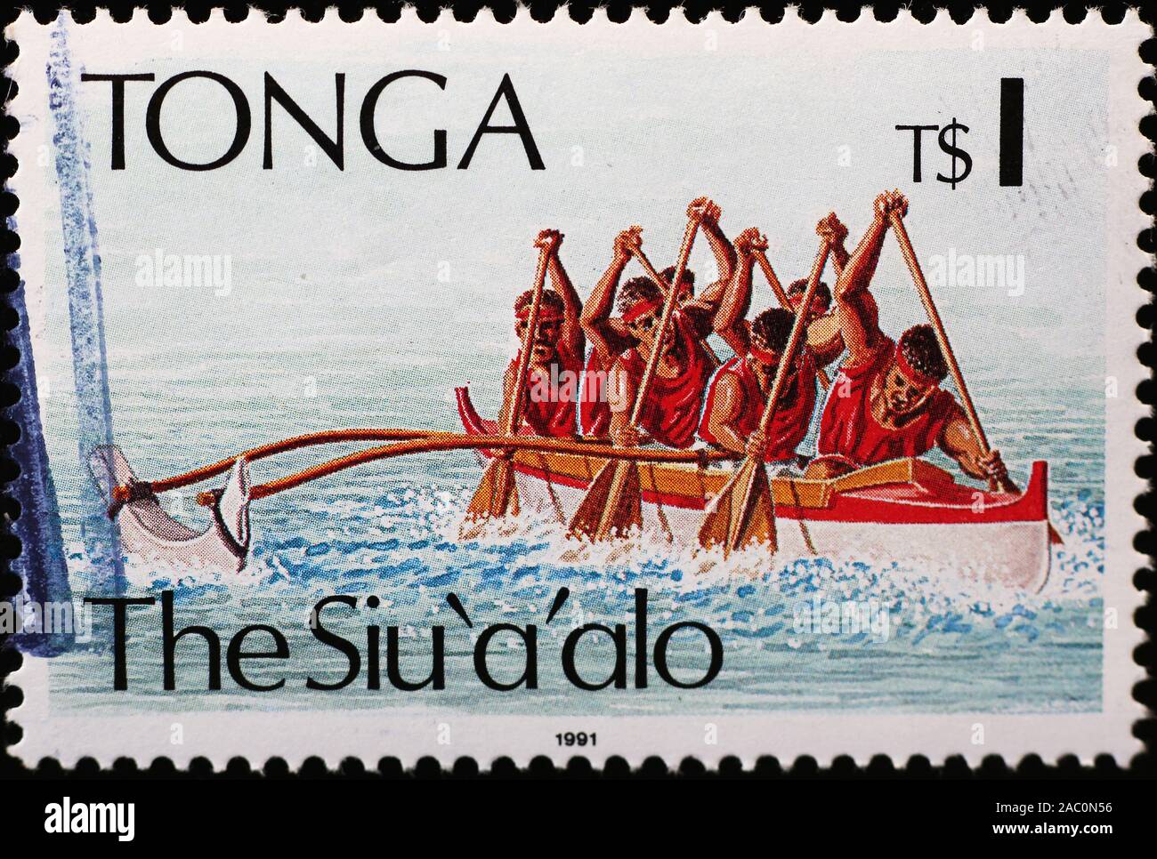 Outrigger canoe on postage stamp of Tonga Stock Photo - Alamy