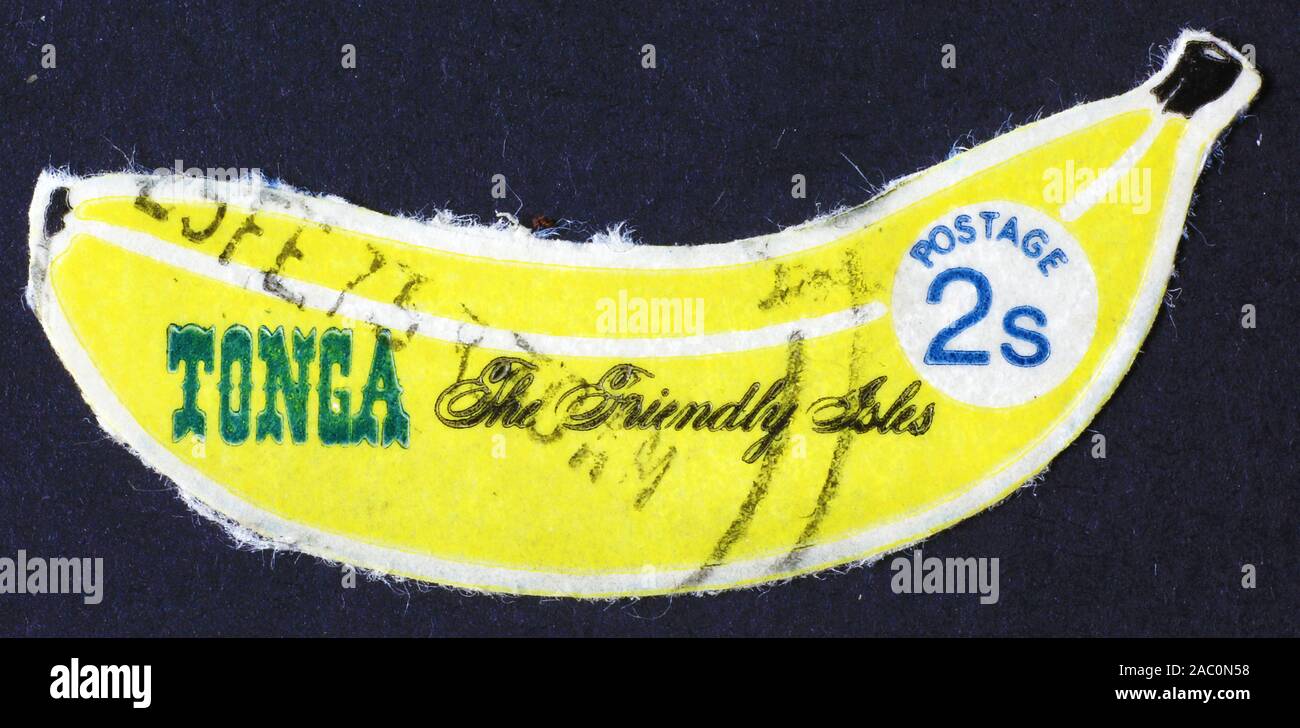 Odd postage stamp of Tonga with a banana shape Stock Photo - Alamy