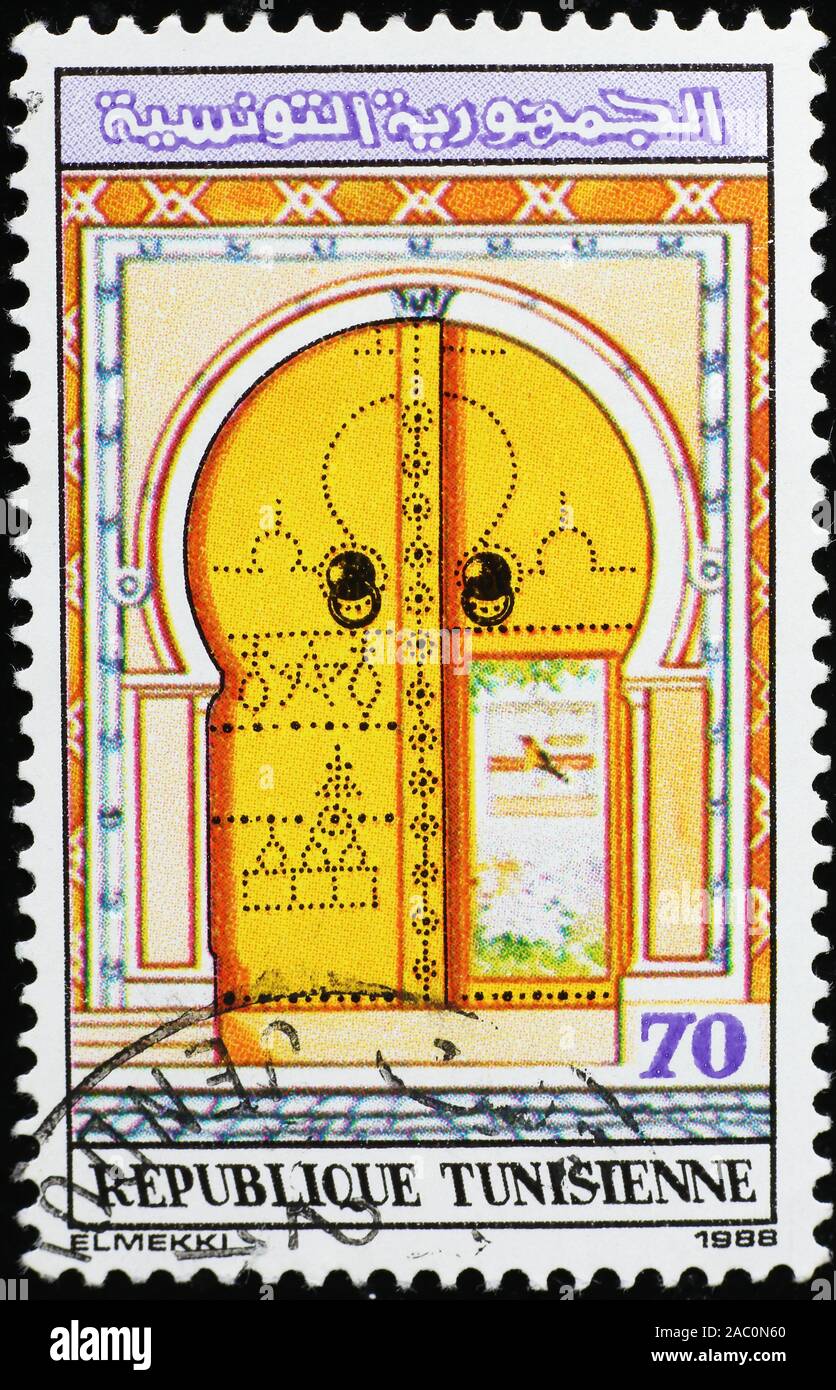 Ancient arabic door on postage stamp of Tunisia Stock Photo - Alamy