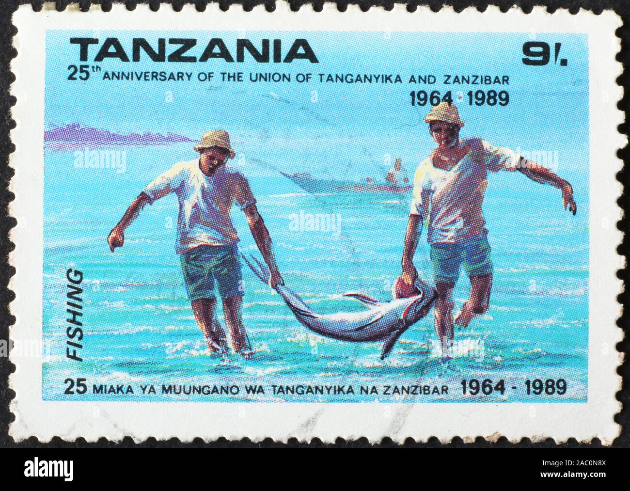 Two fishermen of Tanzania on postage stamp Stock Photo - Alamy