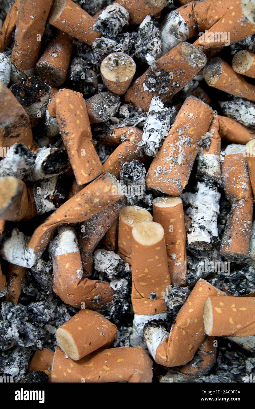 smoked cigarettes in ash tray. symbol to quit smoking Stock Photo - Alamy
