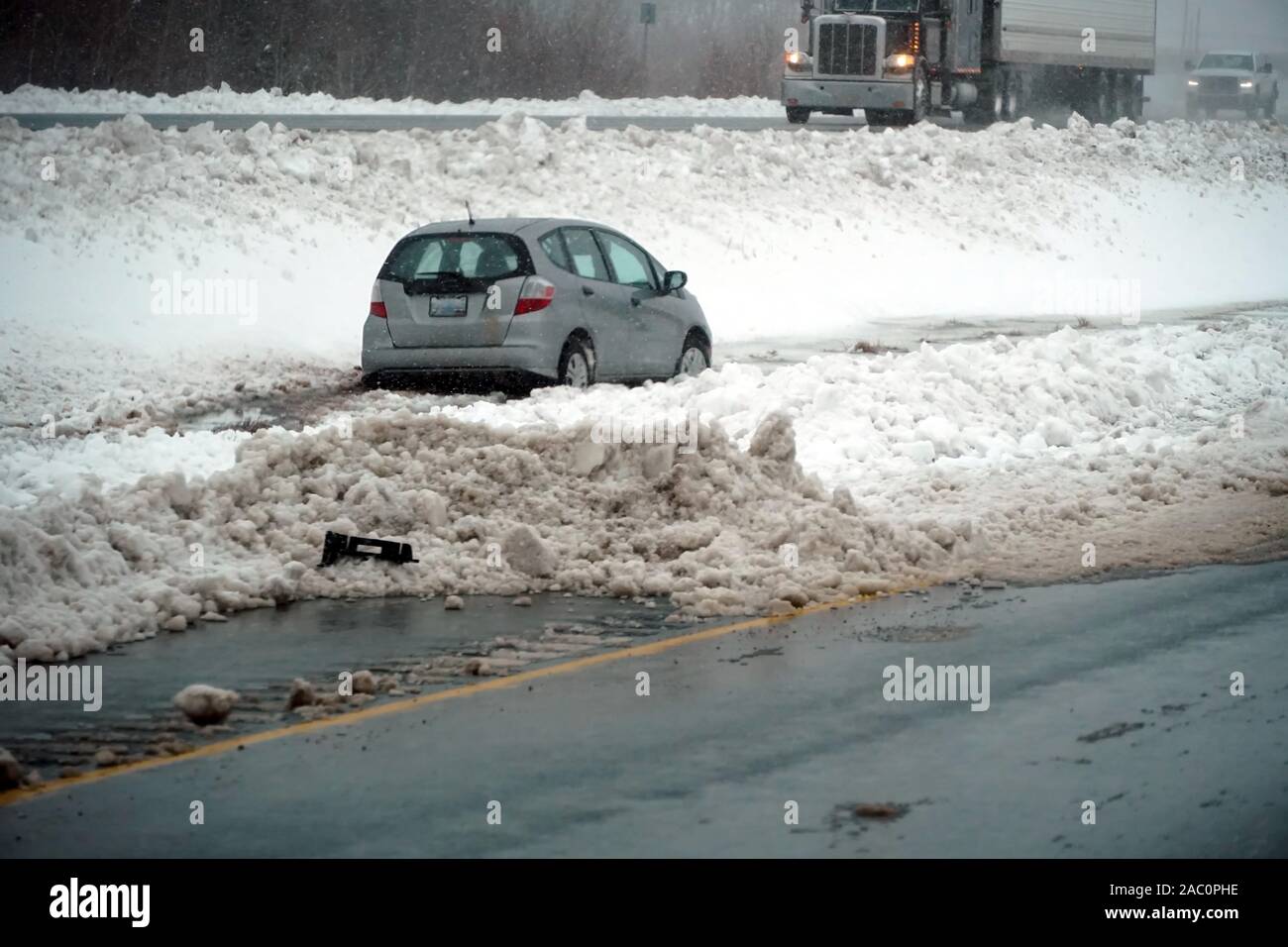 car in center median during bad road conditions and accidents in first ...