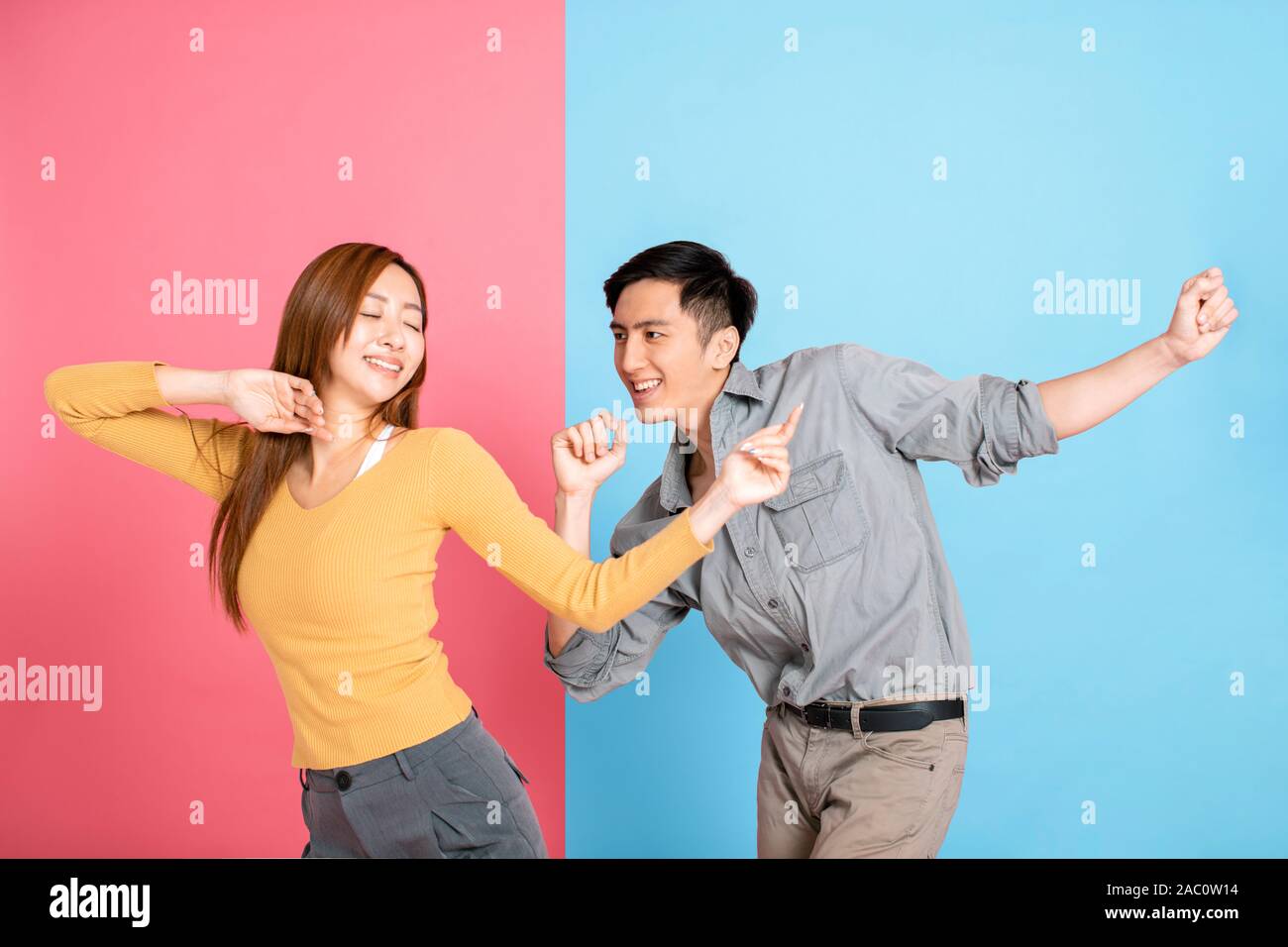 Portrait Of Happy Young Couple dancing Stock Photo - Alamy