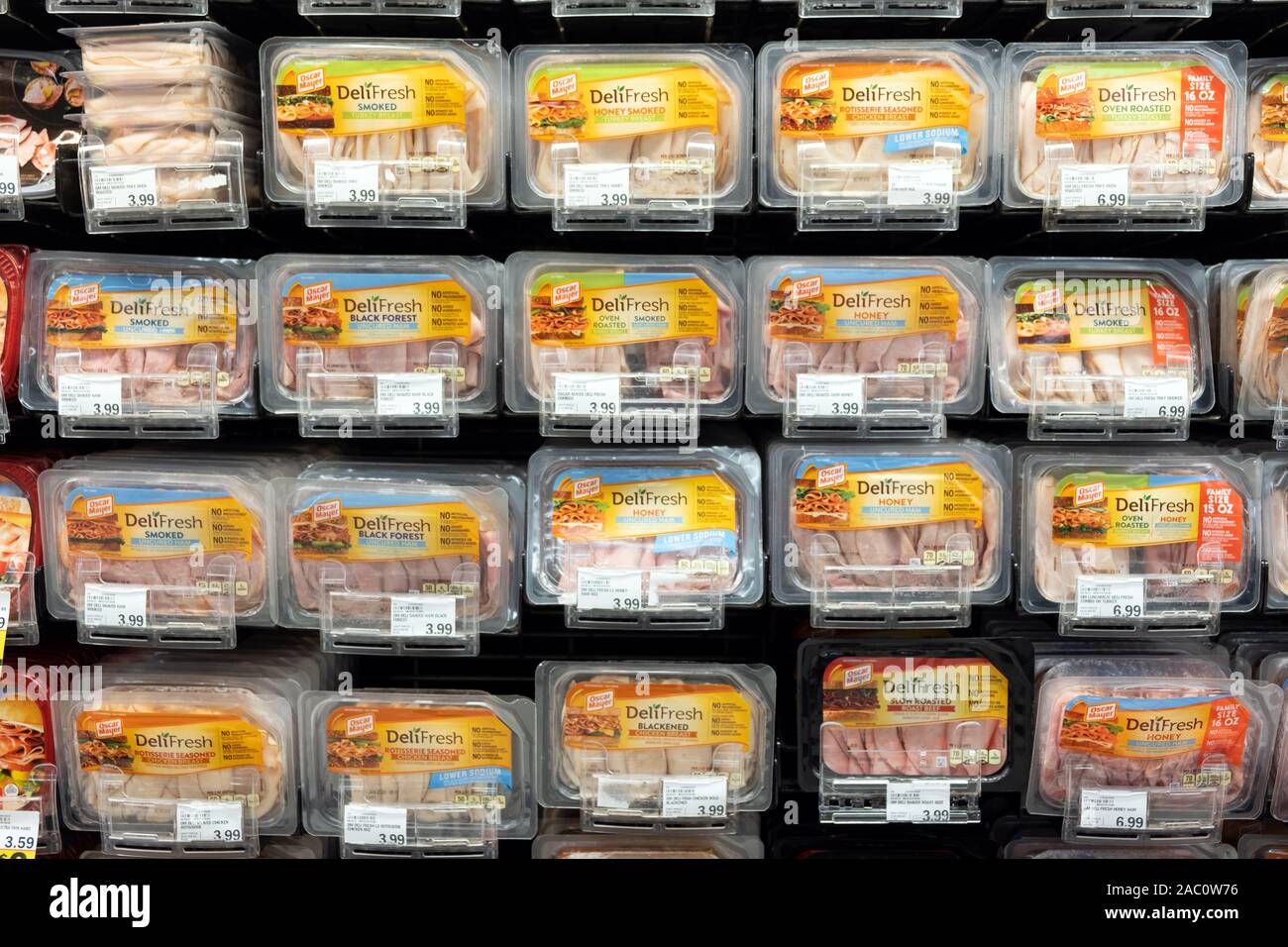 Smoked ham showcase in a supermarket Stock Photo - Alamy