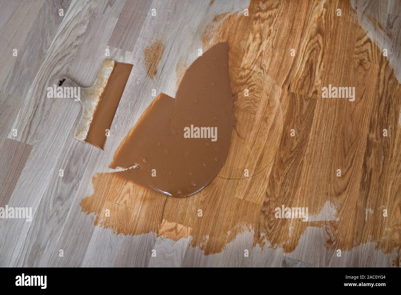 Preparation of parquet grout material. Mixing retainer, varnish and a ...