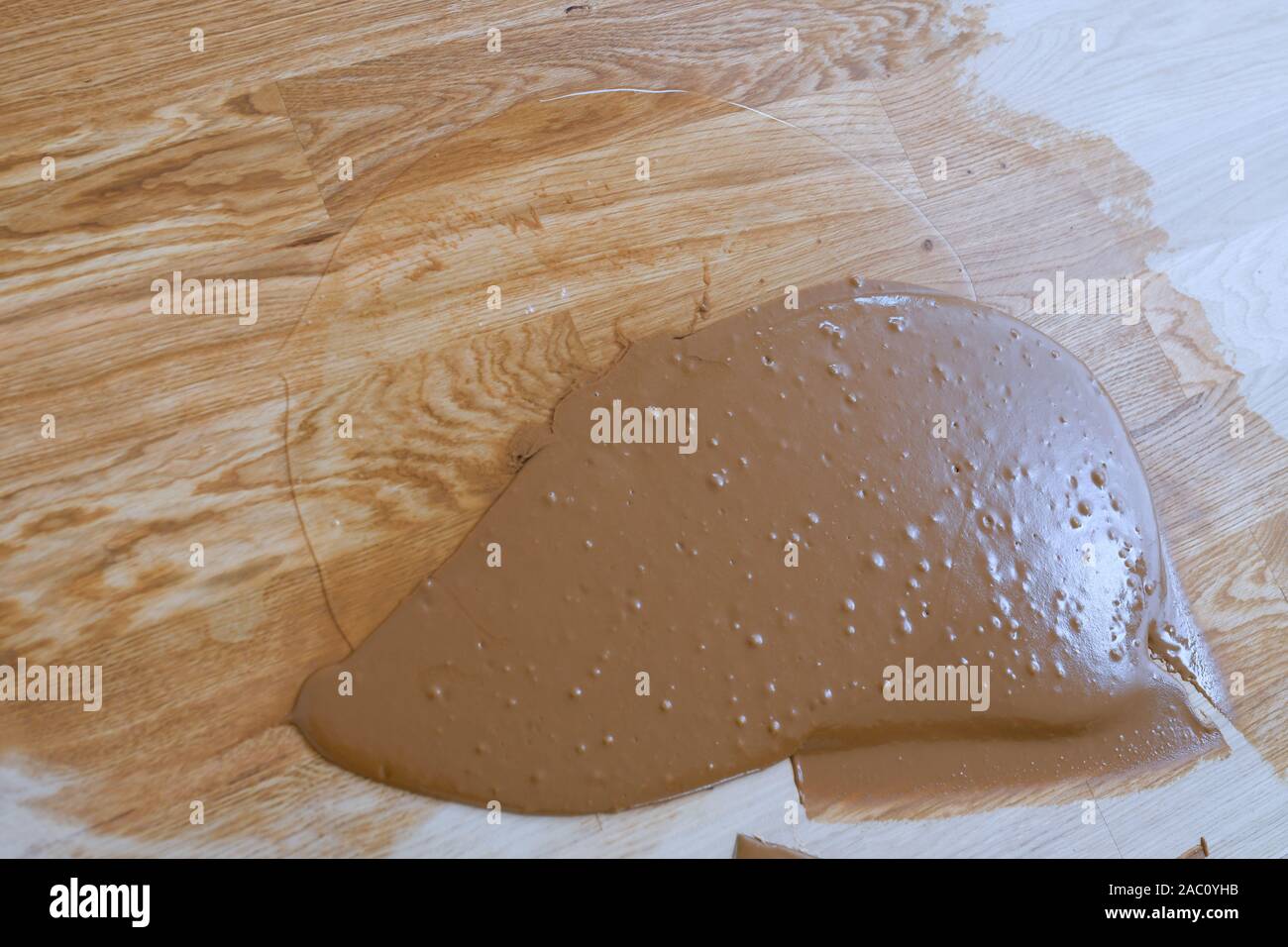 Preparation of parquet grout material. Mixing retainer, varnish and a ...