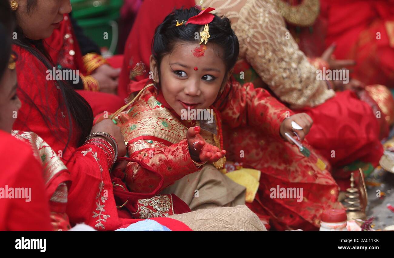 Beijing, Nepal. 29th Nov, 2019. A girl from Newar community gestures as ...