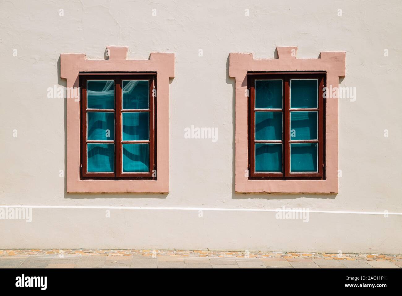 Classic window on beige wall Stock Photo - Alamy