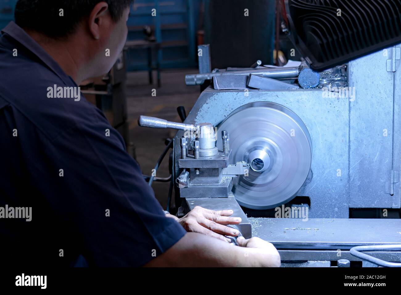Professional workers are doing the milling process for metal parts ...