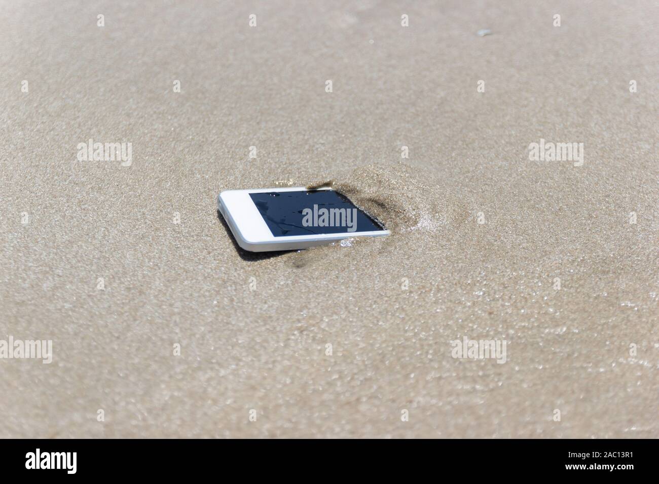 White Mobile phone floated to the sea at the beach Stock Photo - Alamy