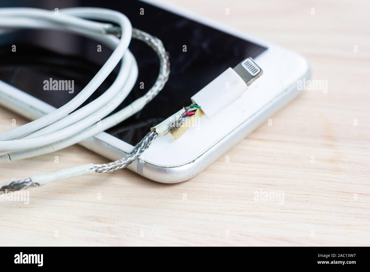 unsafe cable Phone Charger Lack of damage on white background Stock ...