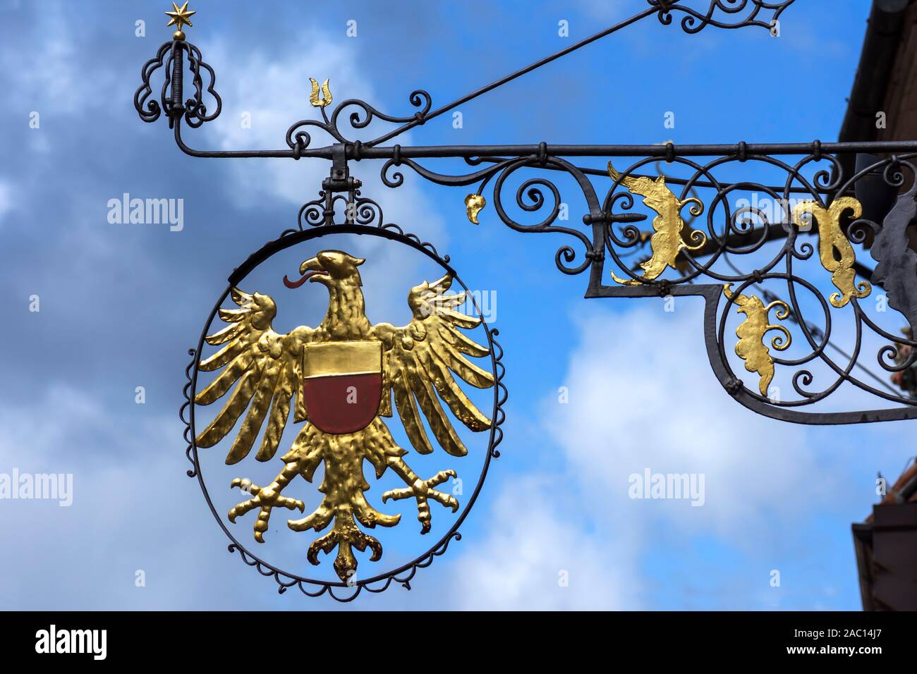 Hanging shop sign with golden eagle hi-res stock photography and images ...