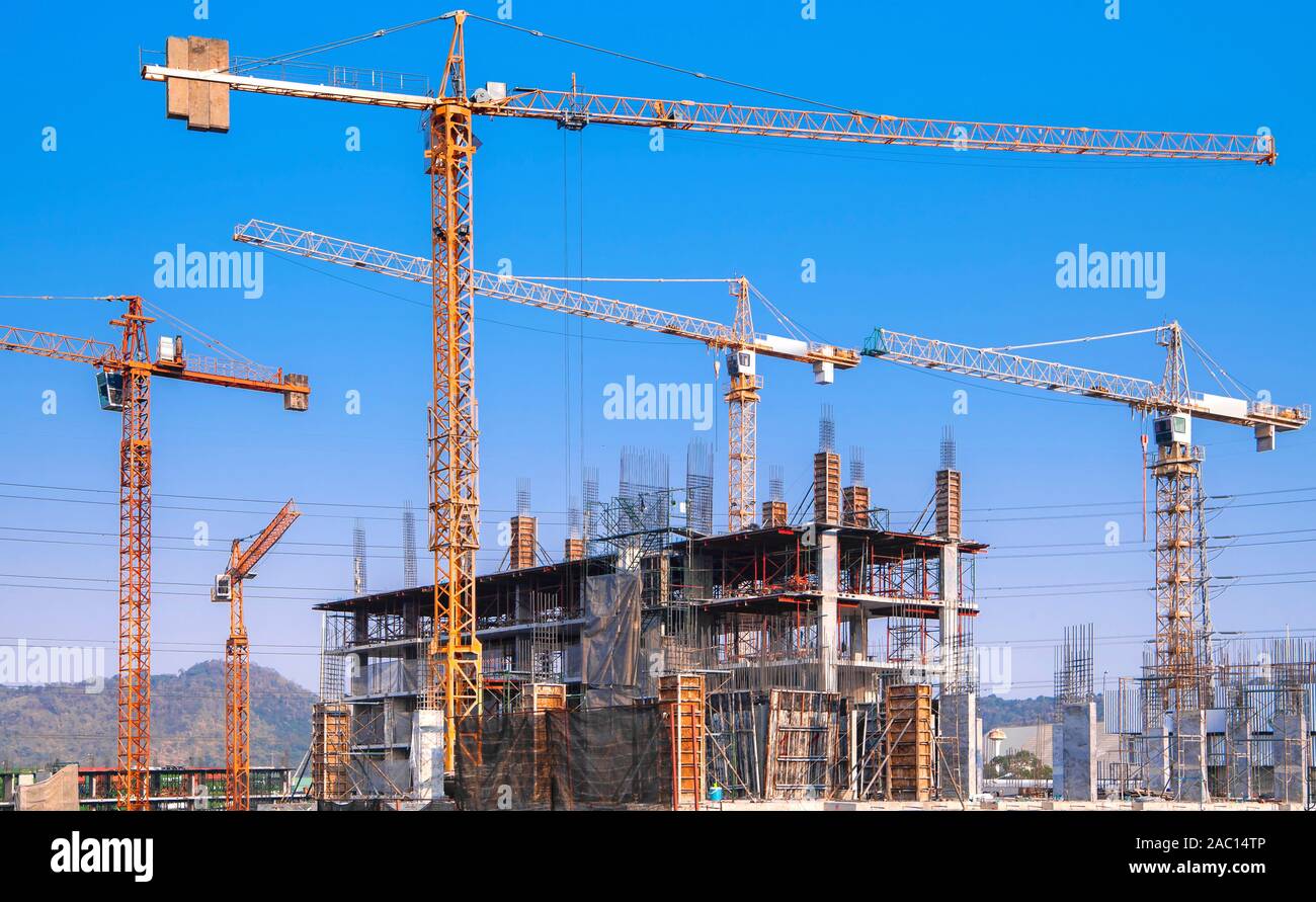 Lots of tower Construction site with cranes and building with blue sky ...