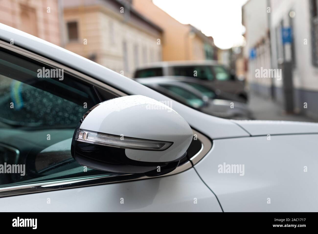 Scenic picture of a street in Sibiu medieval center, cars parked along ...