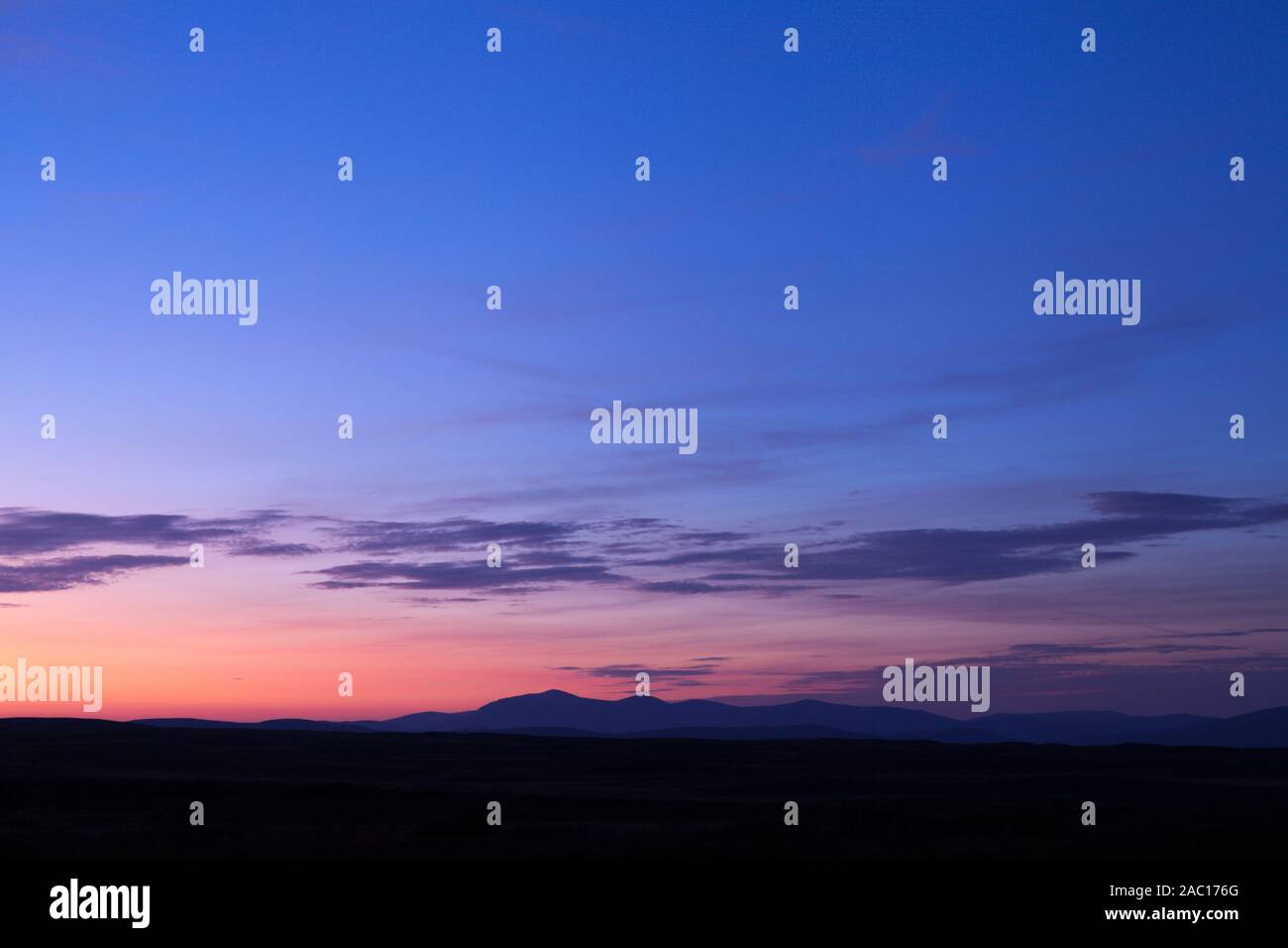 Colorful sky above the mountain landscape in nightfall Stock Photo - Alamy