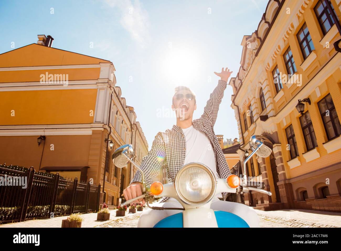 Handsome happy man riding motorbike hi-res stock photography and images ...