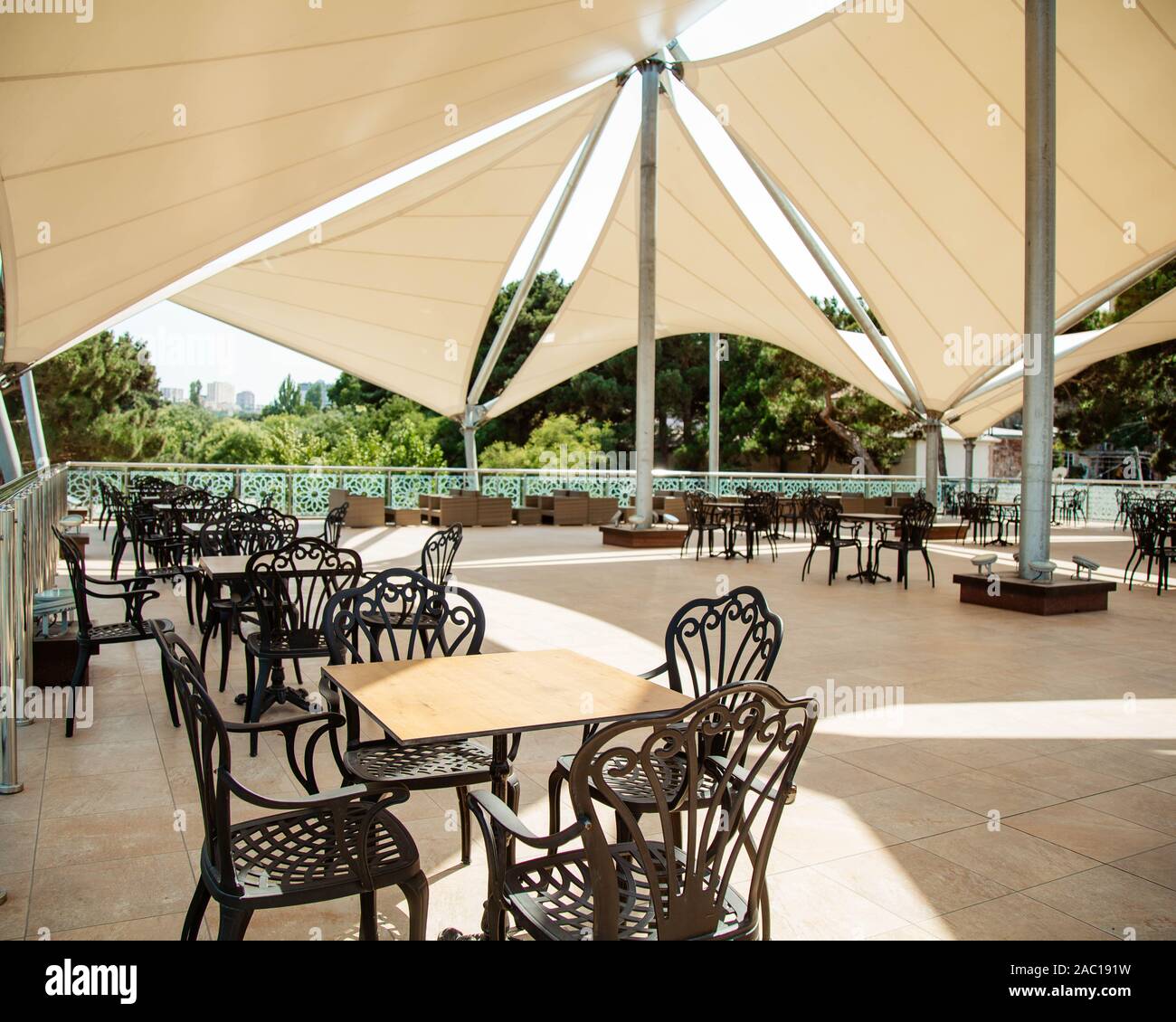 restaurant roof terrace with metal black chairs Stock Photo - Alamy