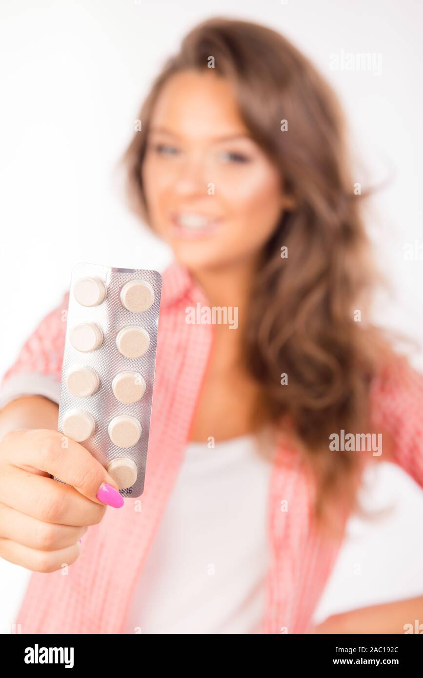 Happy pretty girl holding tablets Stock Photo - Alamy