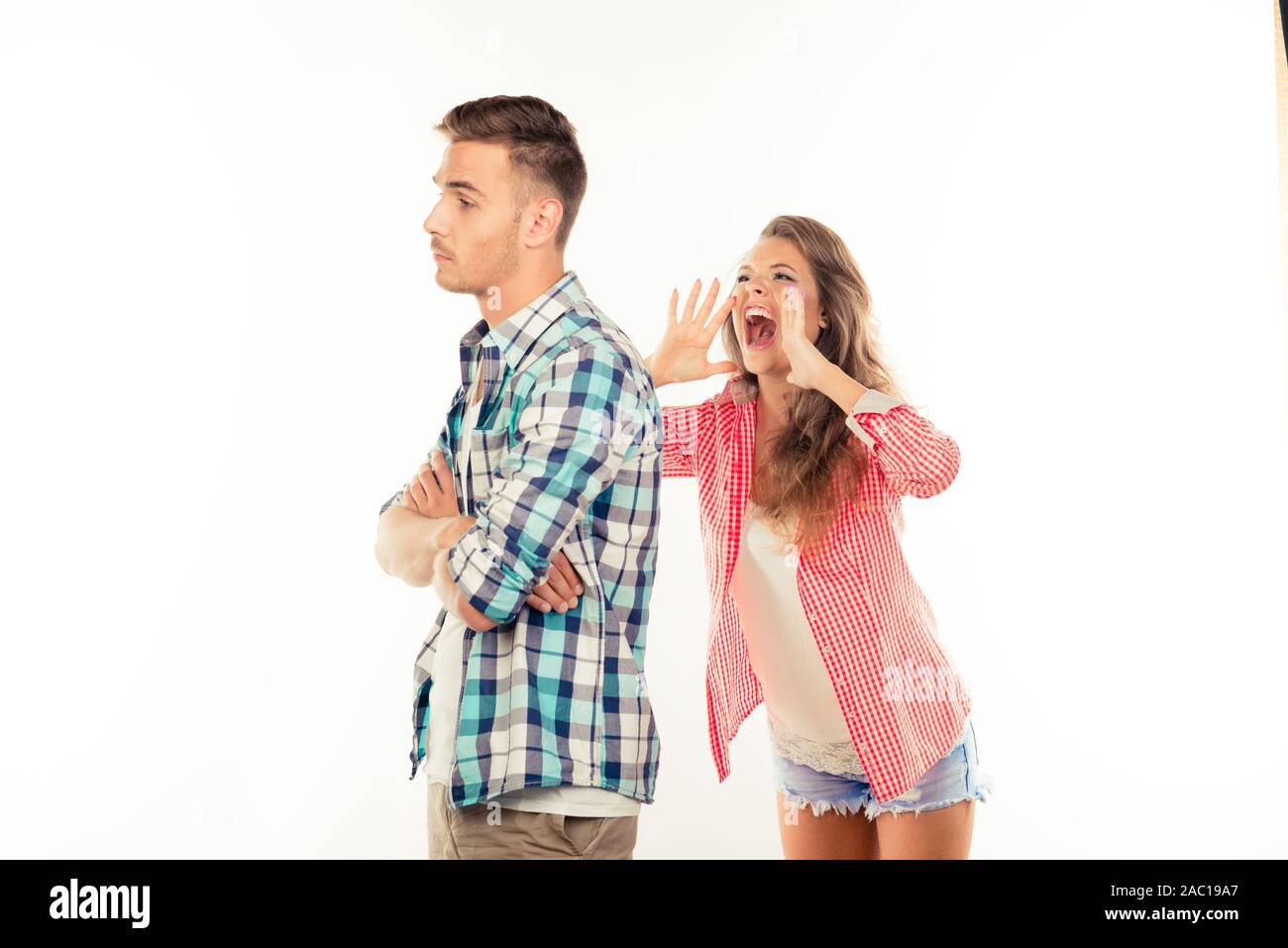 Calm young man ignore his angry girlfriend Stock Photo - Alamy