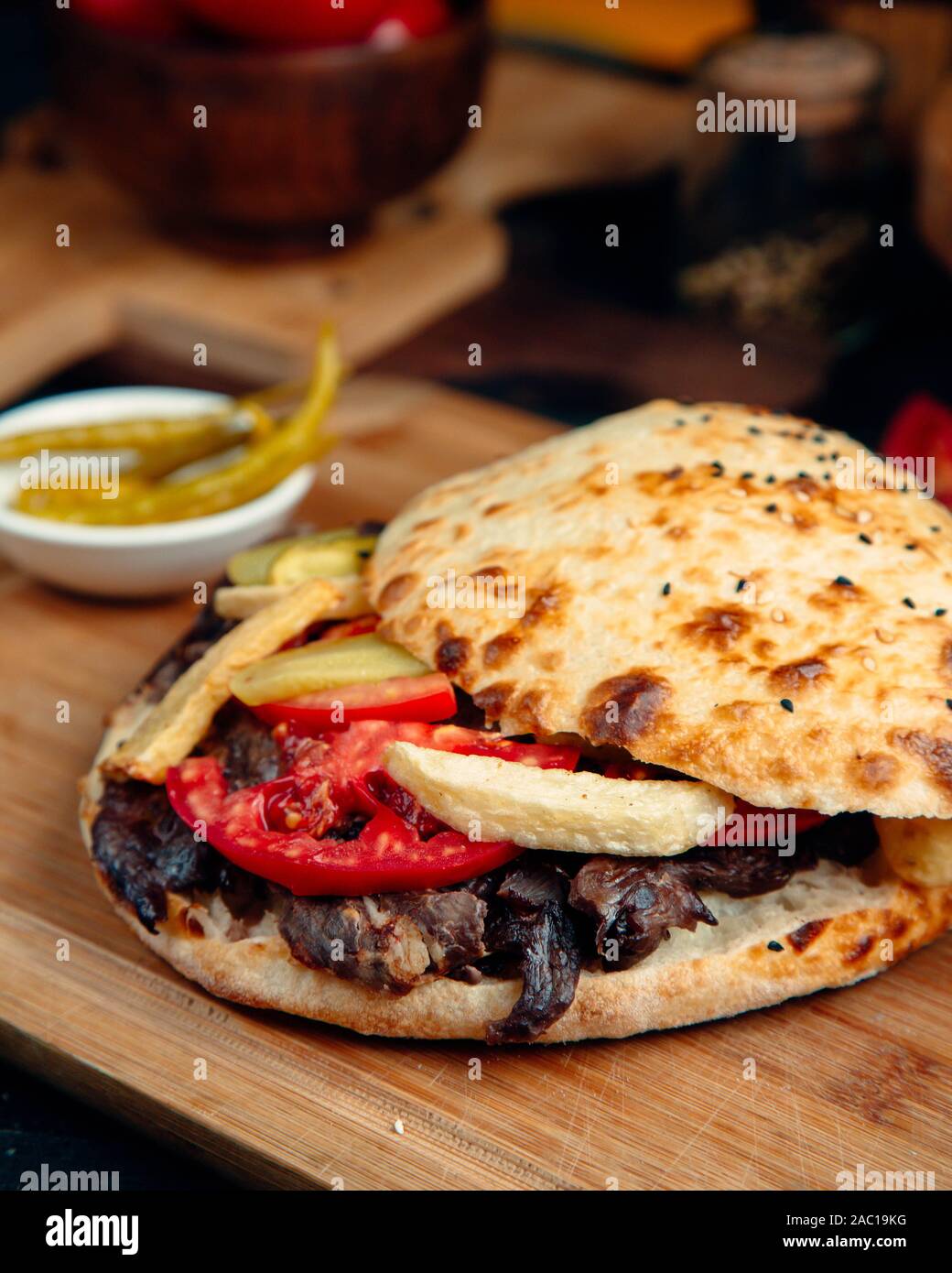 beef doner with tomato, fries and cucumber pickles Stock Photo - Alamy