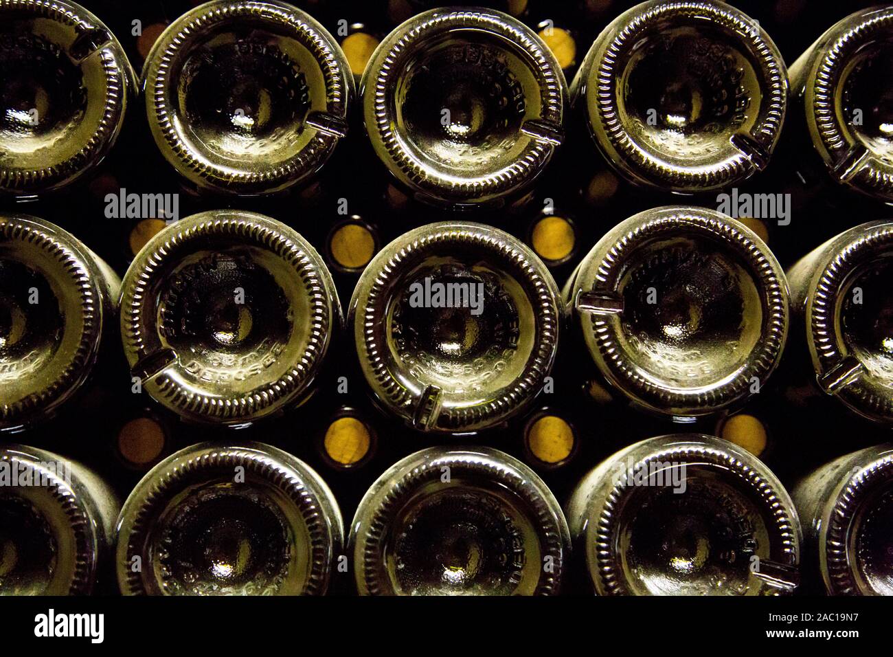 Bottles of wine stacked for maturing in the Chateauneuf du Pape region ...