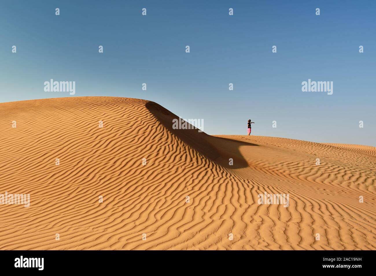 Tourist on the Wahiba Sands desert in Oman beautiful shaped desert ...