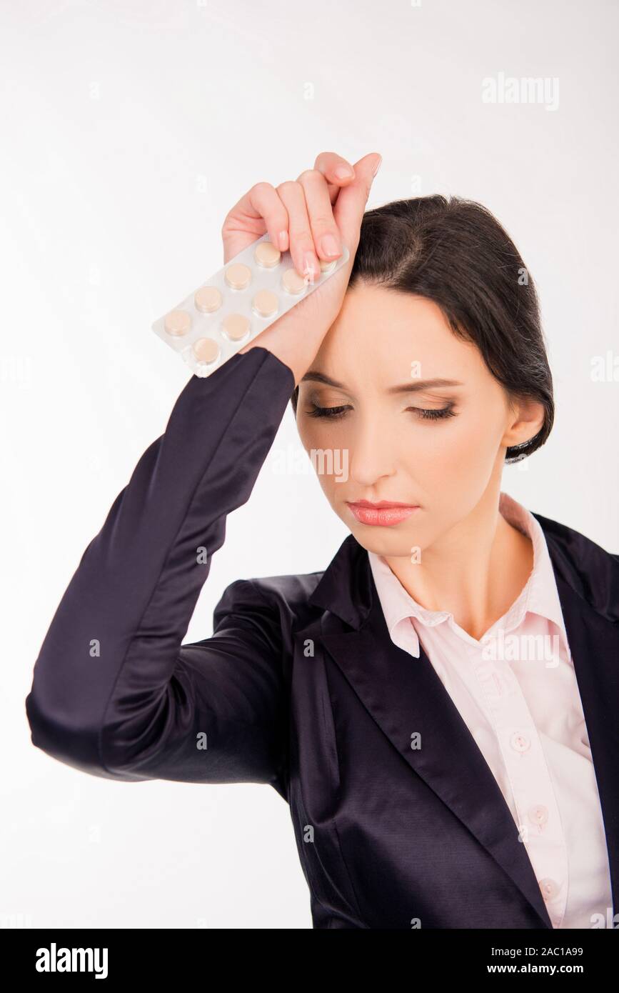 Feeling headache. Frustrated young woman holding headache tablets Stock ...