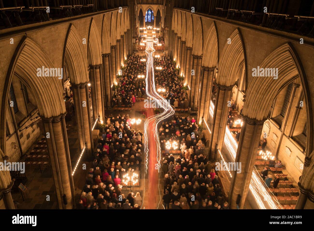Candles are carried through Salisbury Cathedral during the advent ...