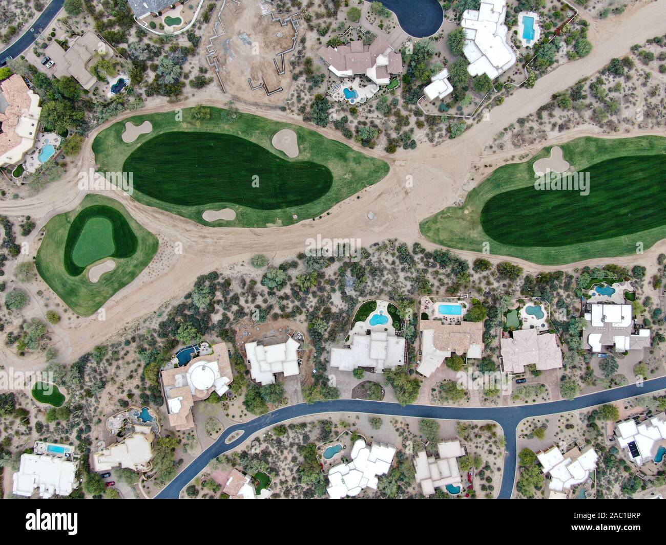Aerial view above golf course and upscale luxury homes in Scottsdale ...