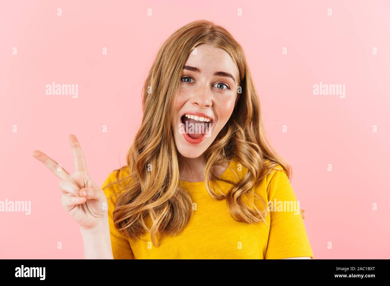 Image of a young emotional cheery optimistic cute girl isolated over ...