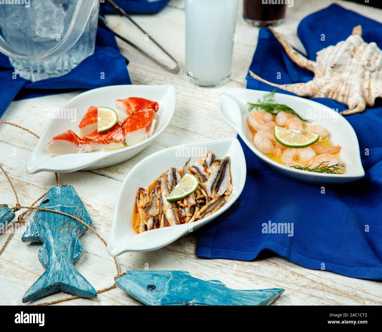 seafood side dishes with platter of shrimp, squids and fish Stock Photo ...