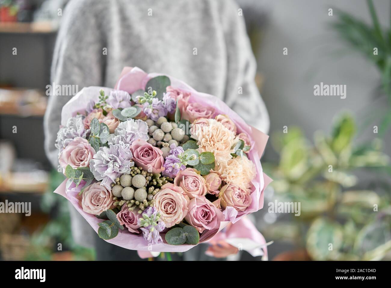 Modern floral shop. Finished work of the florist. Cute bouquet of mixed ...