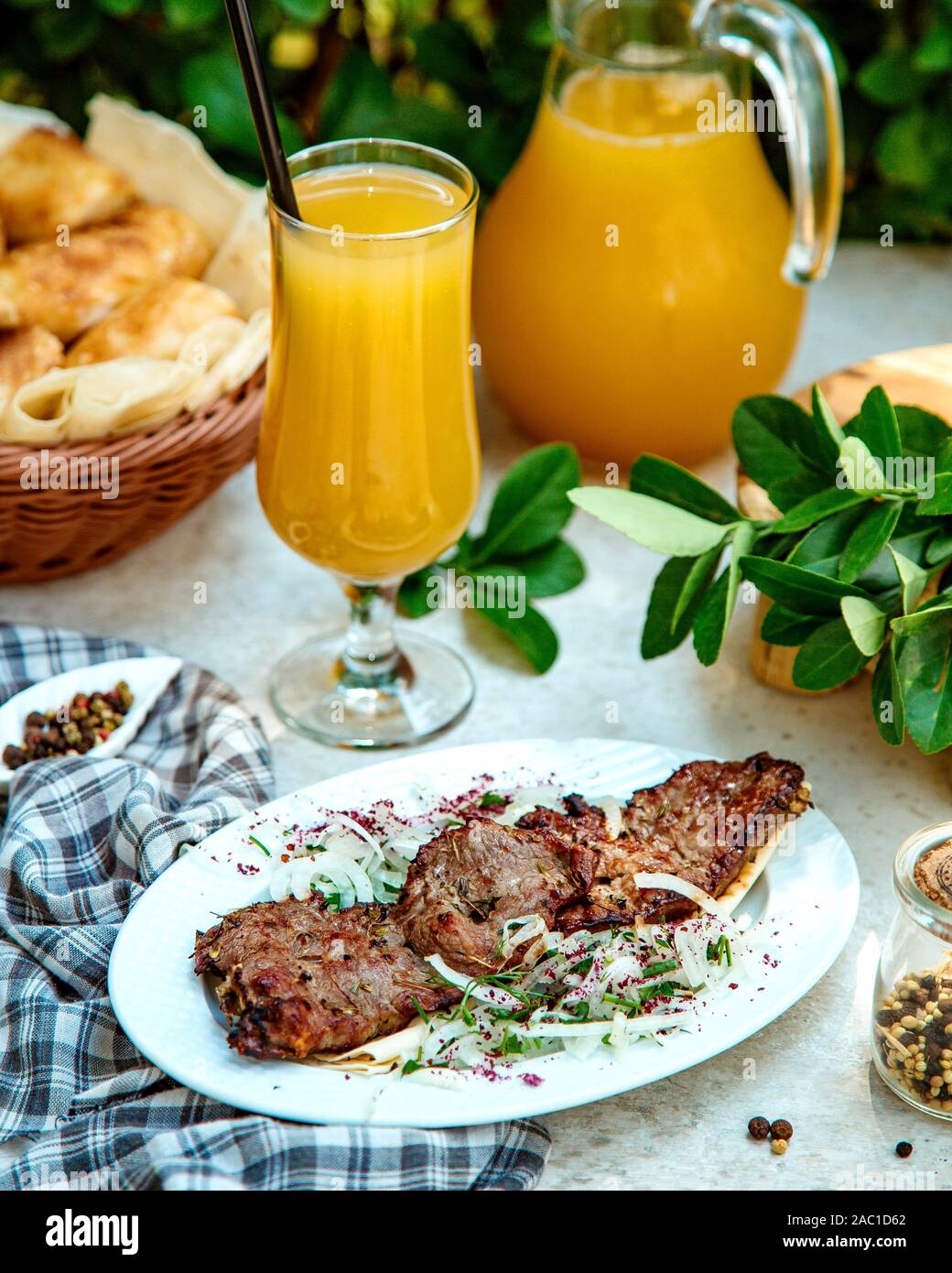 marinated beef with onion, herbs and sumac Stock Photo - Alamy